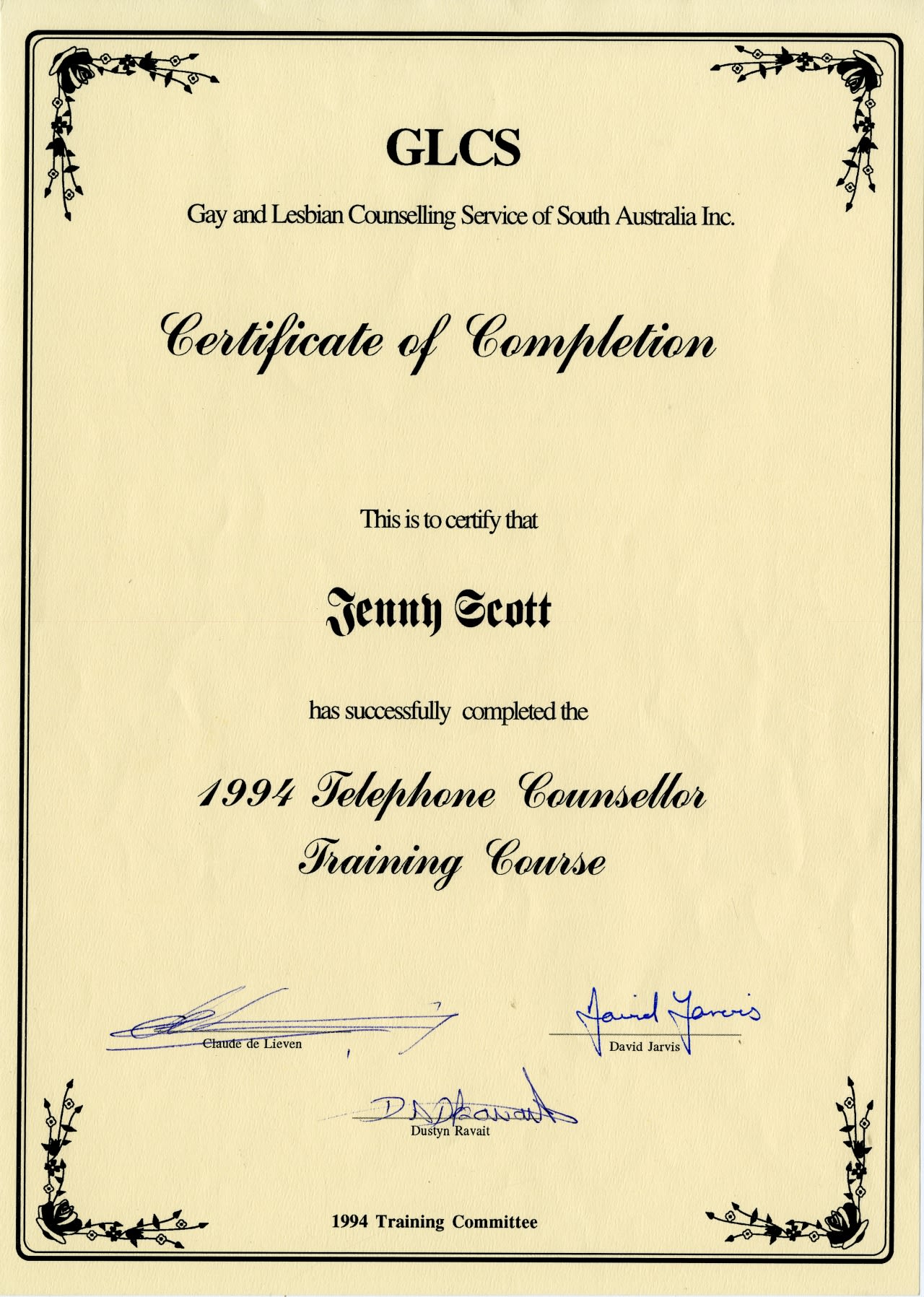 Certificate on beige paper with black text and blue ink signatures.