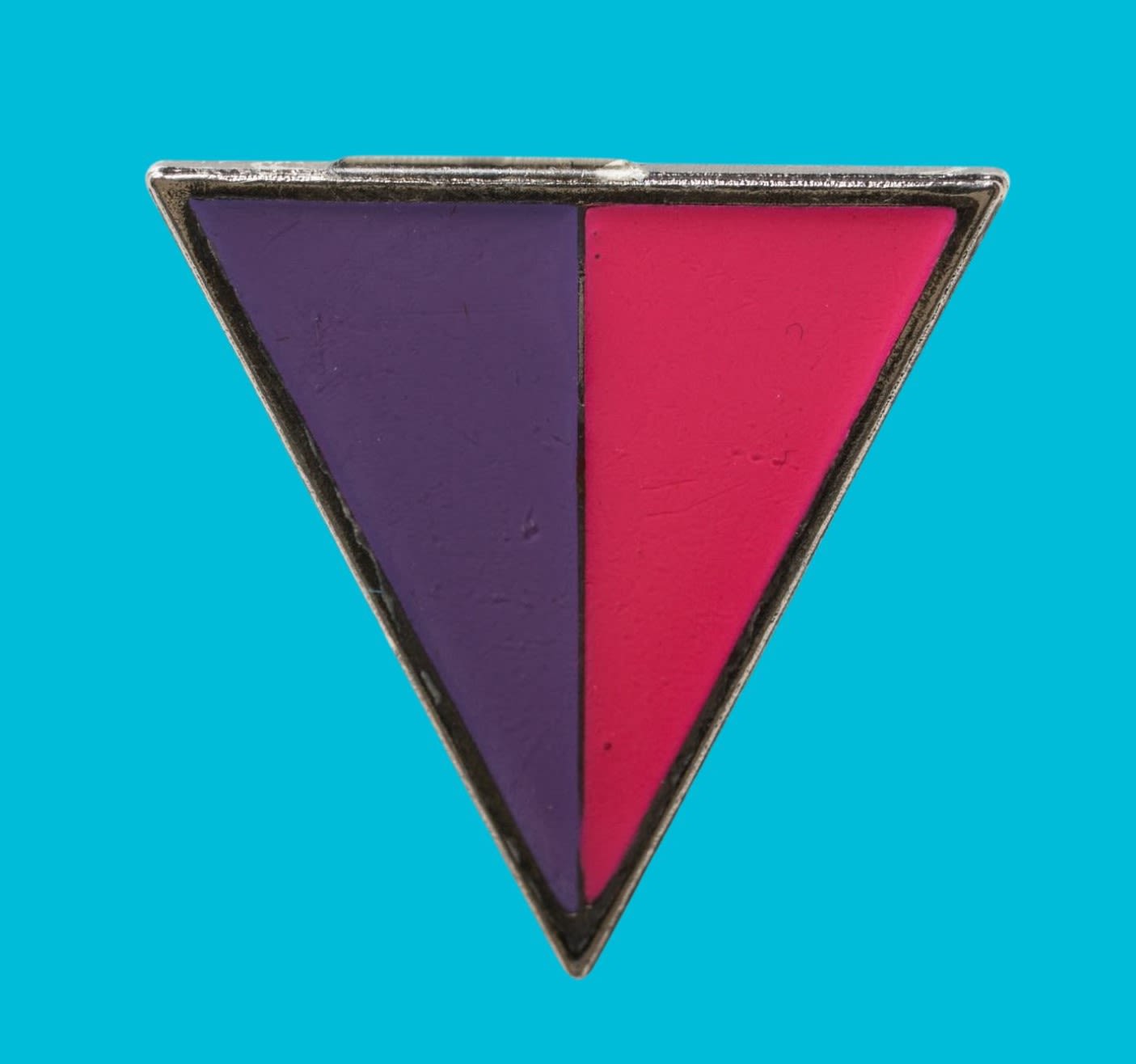 Image of purple and pink upside-down triangle badge
