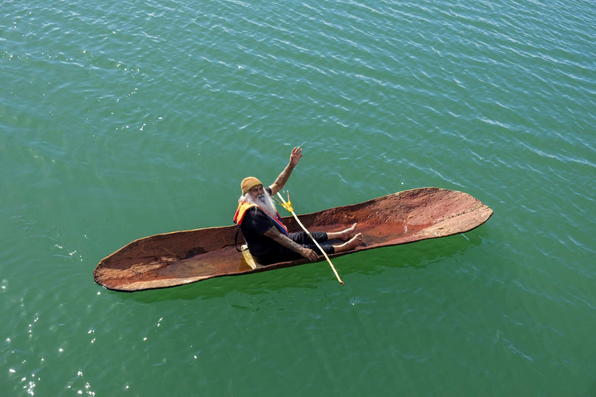 Ngarrindjeri Elder, Uncle Moogy' sits in the yuki, bark canoe, on the ...